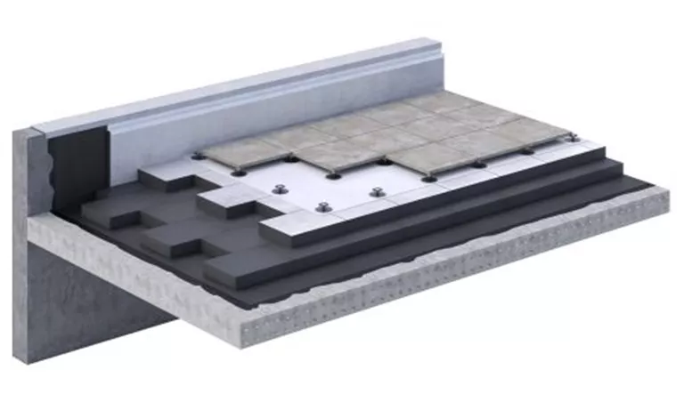 Non-combustible inverted roof insulation with ballast finish